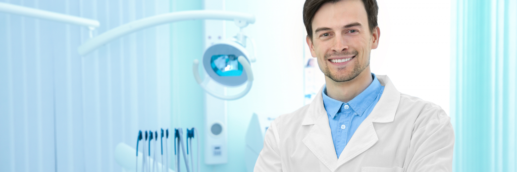 smiling-male-dentist - Fort Dental Health Group